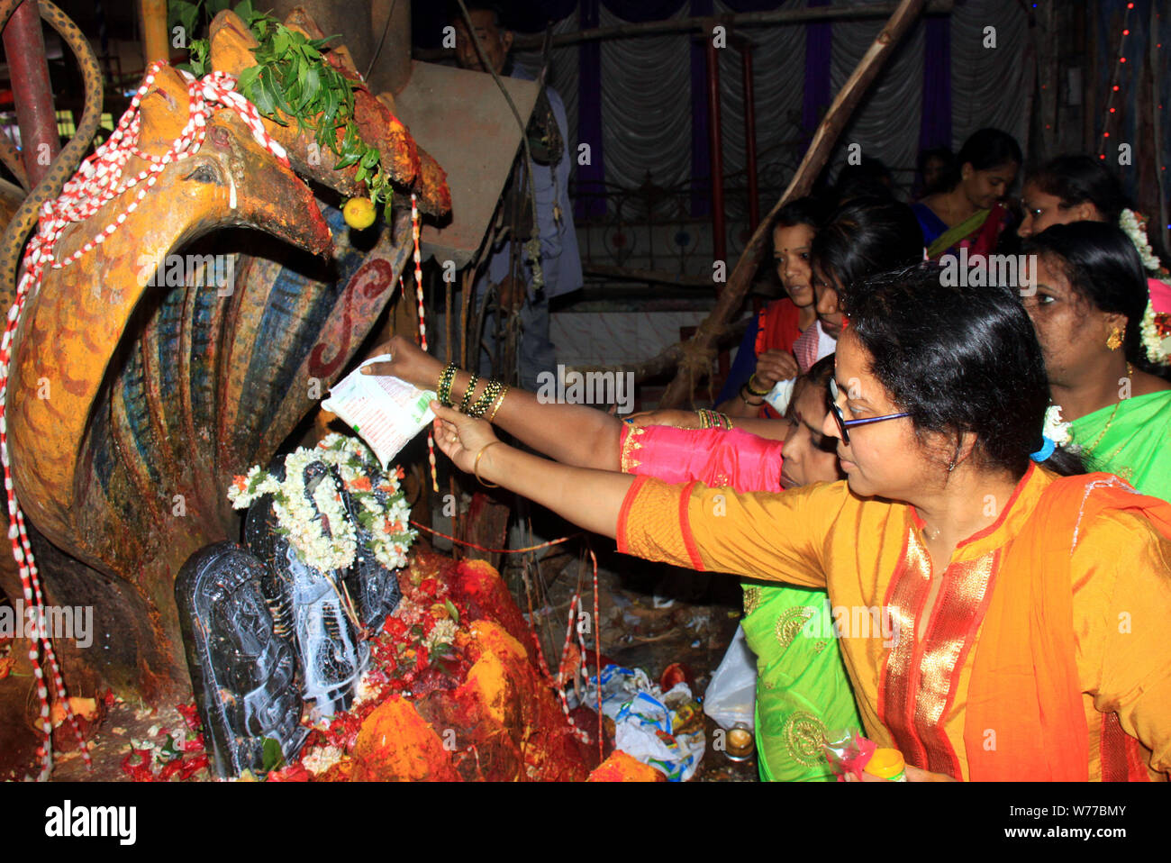 Bangalore, India. 5th Aug, 2019. Indian Hindu devotees offer prayers at ...