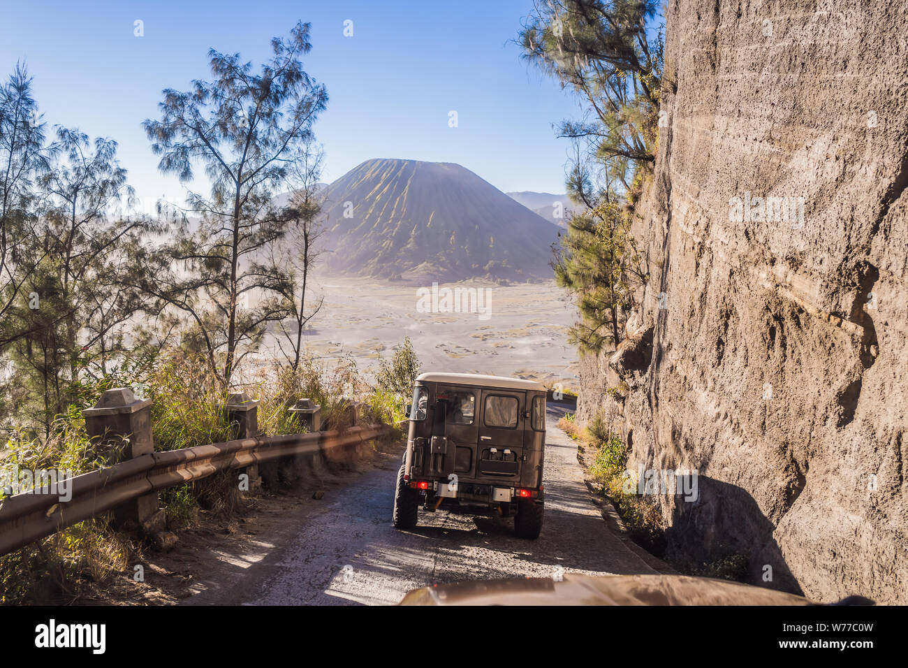 View from the inside of an offroad car riding down the road at the ...