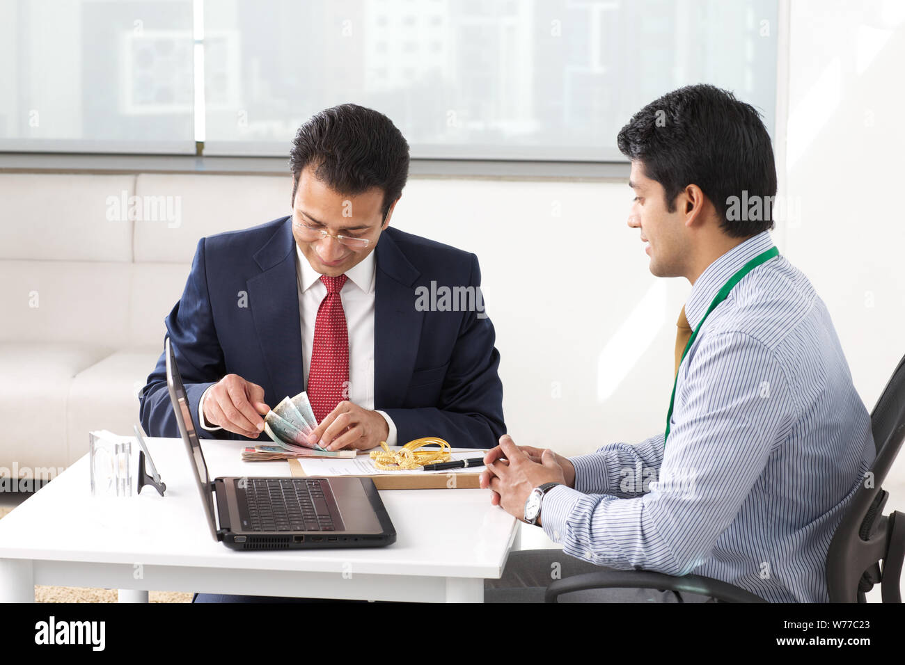 Middle aged man counting money hi-res stock photography and images - Alamy
