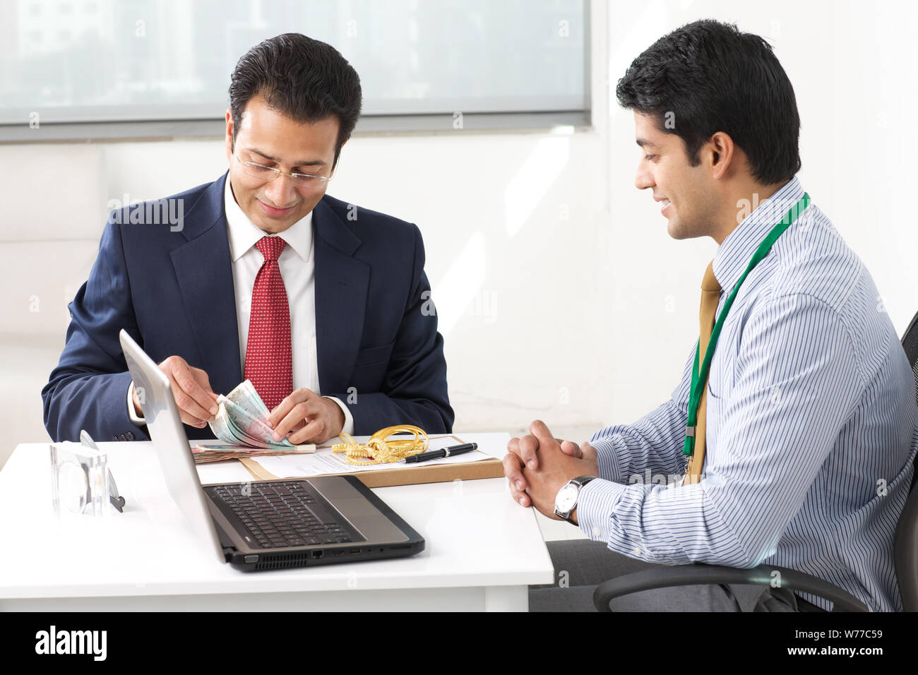 Middle aged man counting money hi-res stock photography and images - Alamy