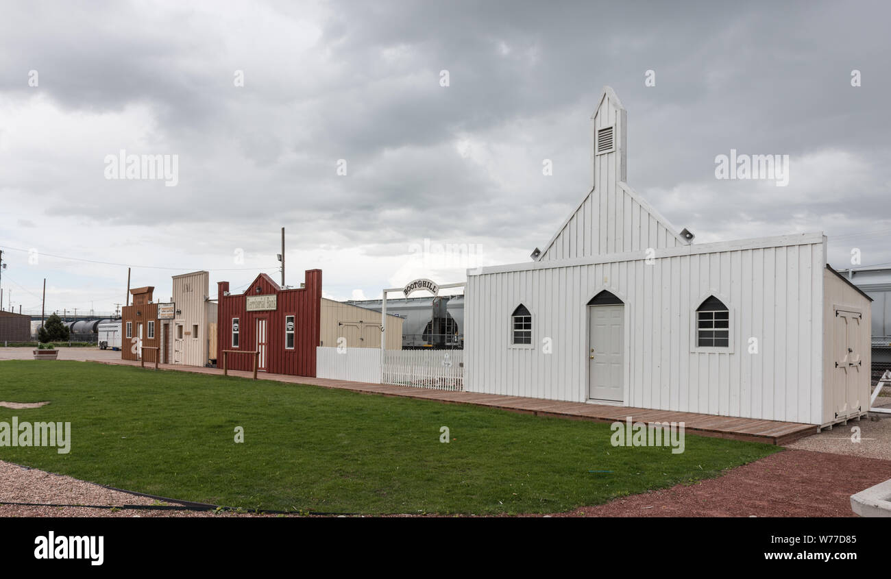 A small row of old west facades fronting the freight-train tracks in ...