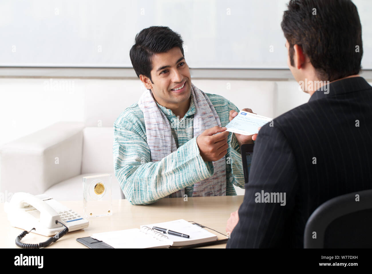Bank cheque teller hi-res stock photography and images - Alamy