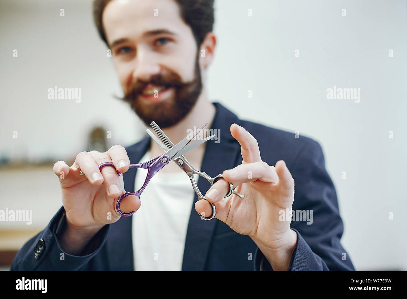 Stylish man standing in a barbershop Stock Photo - Alamy