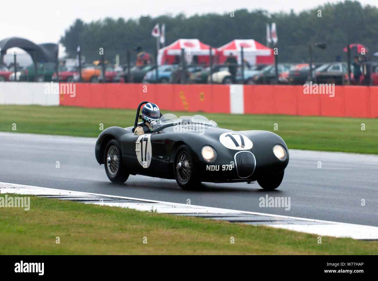 A Green, 1953, Jaguar C-type races down the Wellington Straight, at ...