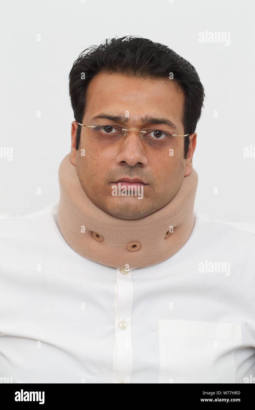 Mature man wearing a neck brace Stock Photo - Alamy