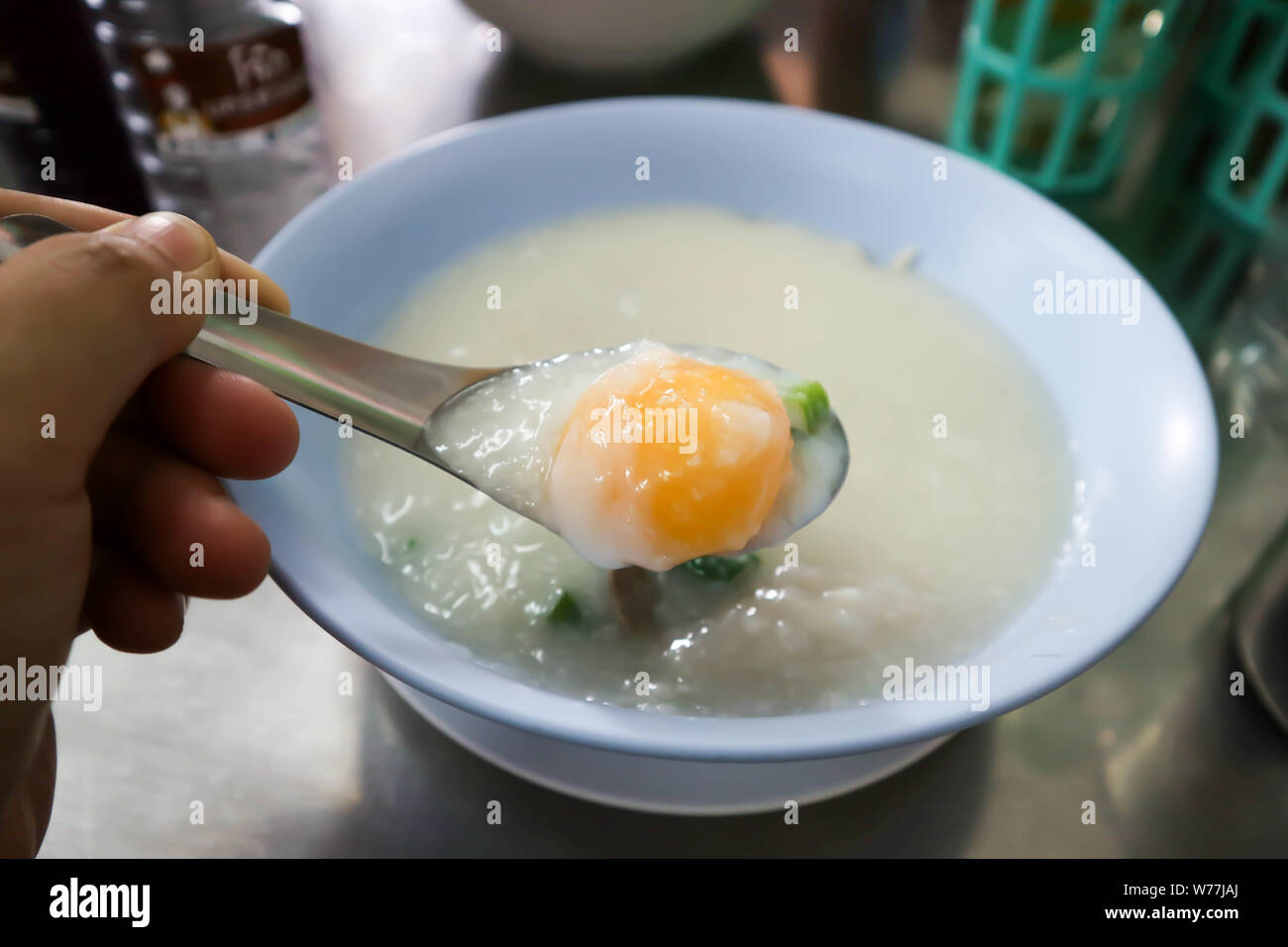 eating rice gruel, rice porridge or congee dish Stock Photo - Alamy