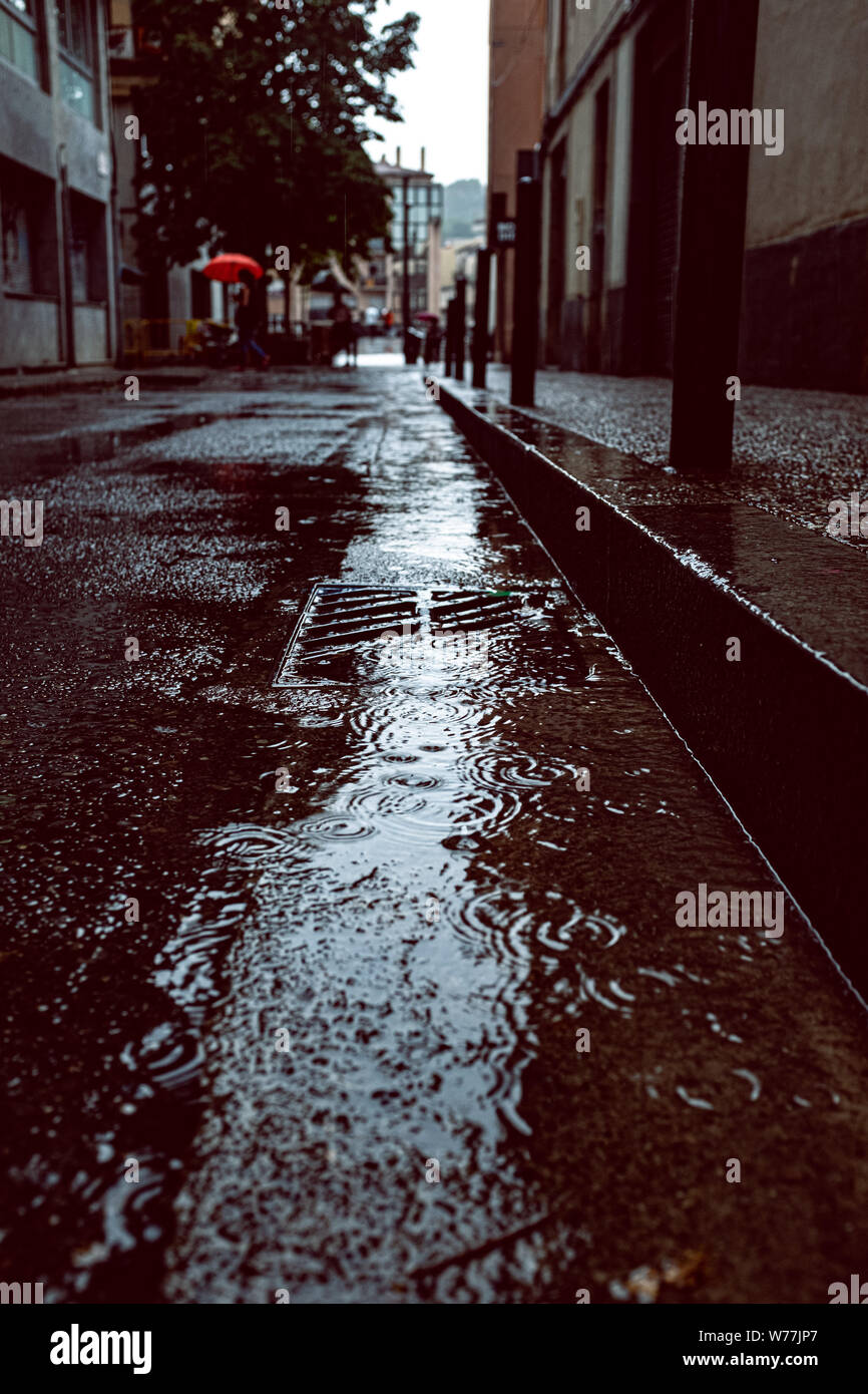Rainy urban scene with water drops falling on a wet floor Stock Photo ...