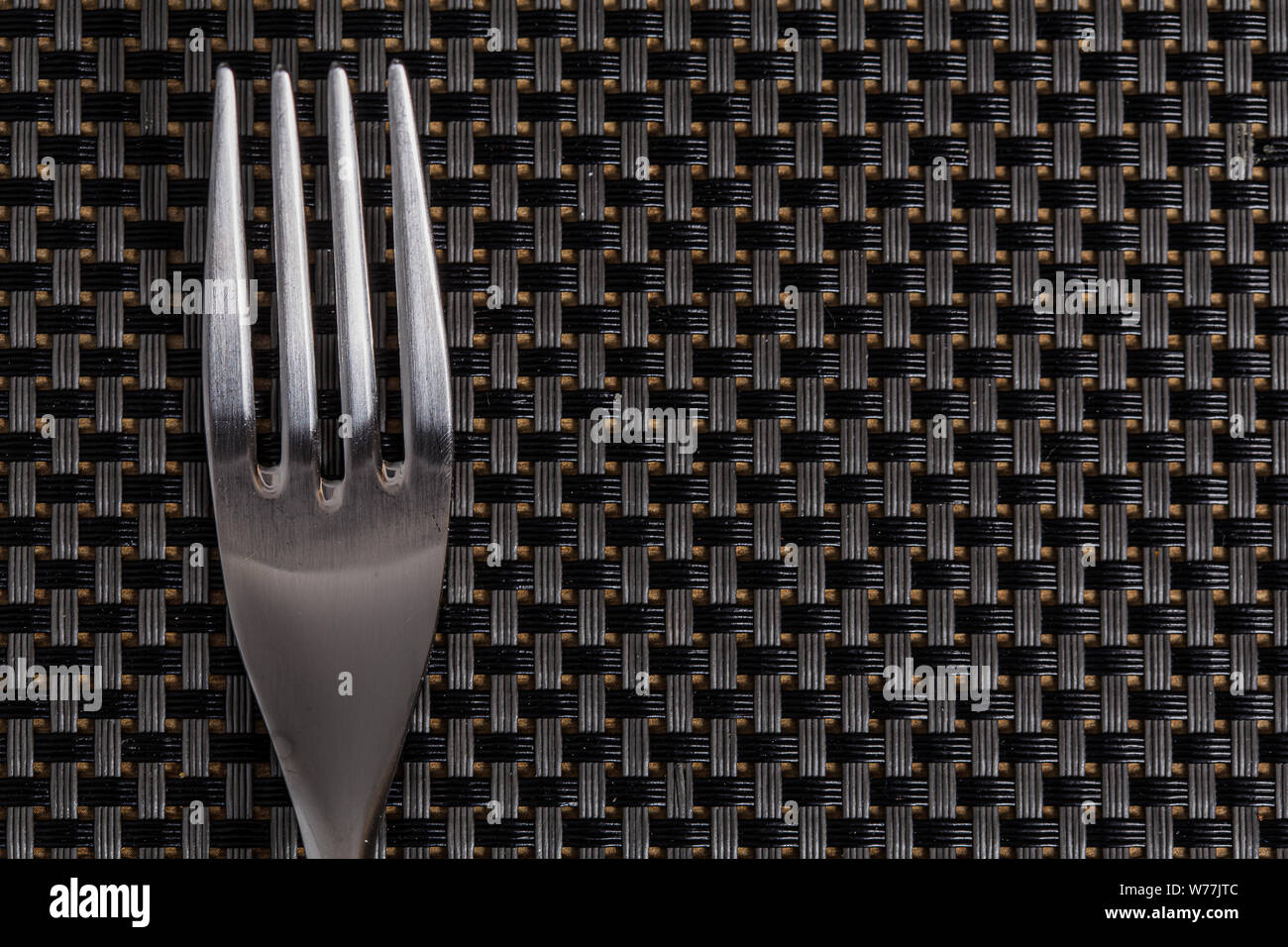 Bright silver grey fork cutlery on a pattern grey background Stock ...
