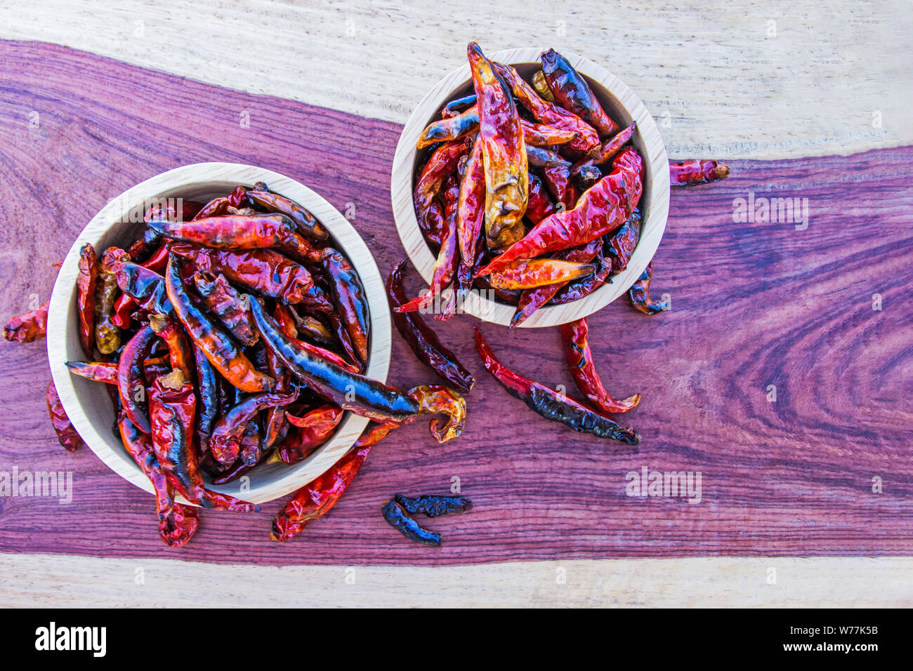 Chili burn in wooden bowl put on table. Top view Stock Photo - Alamy
