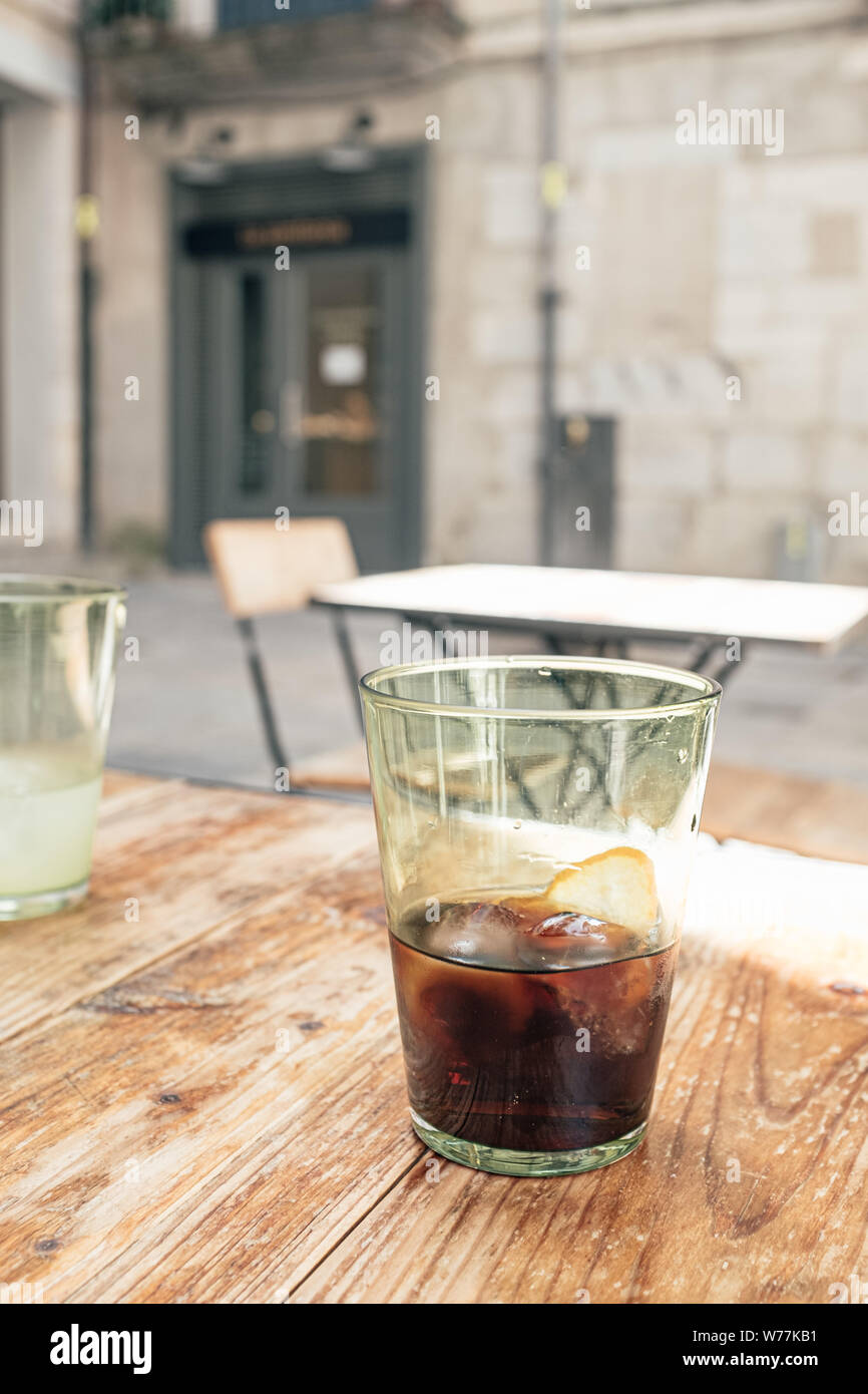 Vermouth drinking glass on an outdoor terrace scene Stock Photo - Alamy