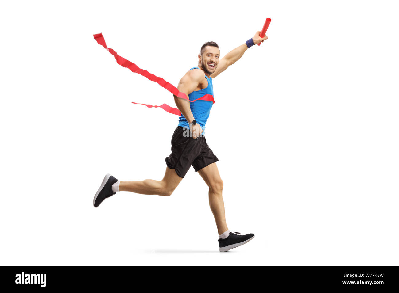 Full length shot of a man on the finish line of a marathon race with a ...