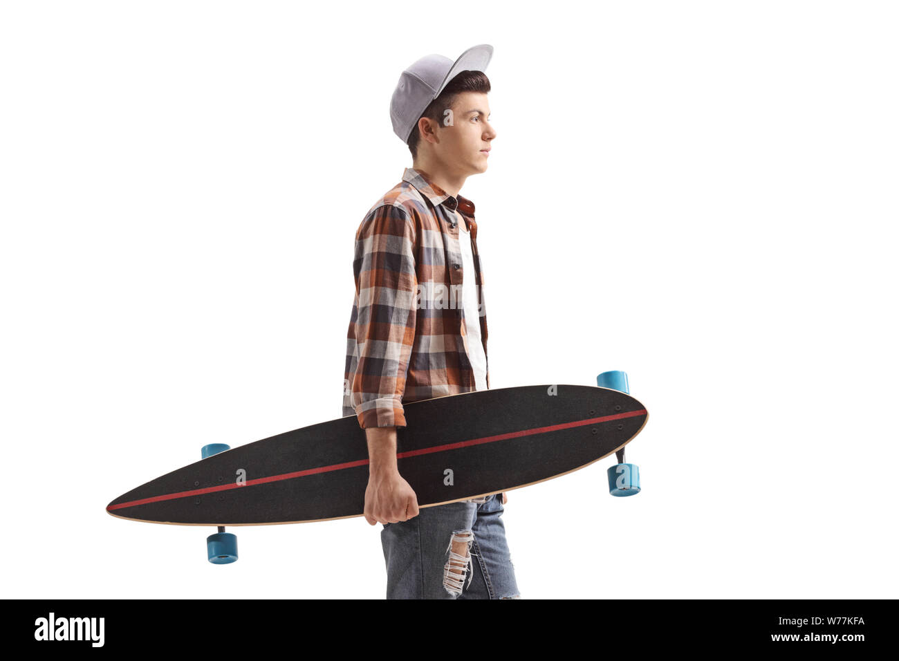 Male teenager with a longboard standing isolated on white background ...