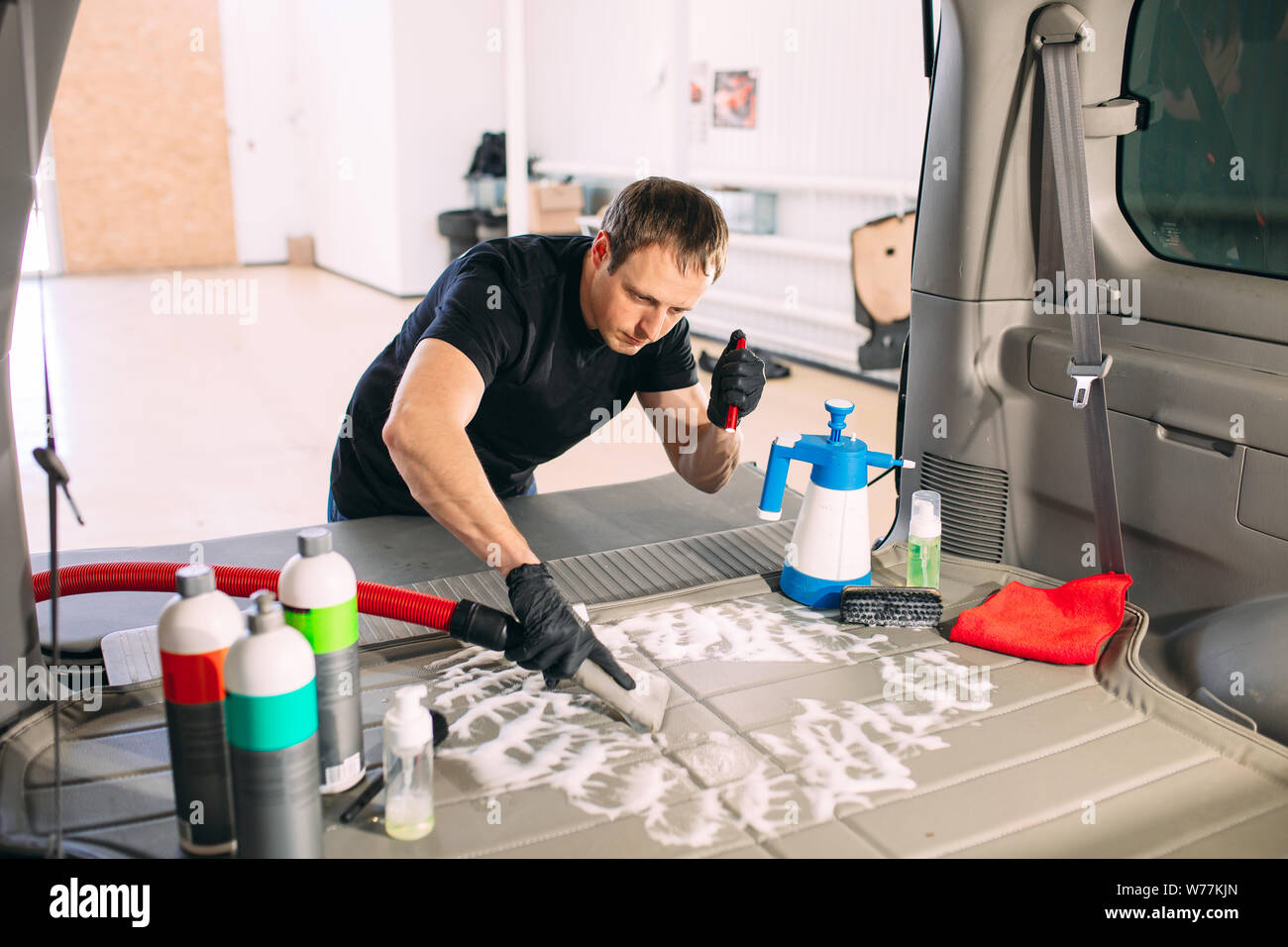 Car chemist. Chemical treatment of the car trunk Stock Photo - Alamy