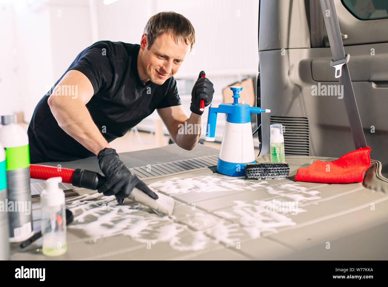 Car chemist. Chemical treatment of the car trunk Stock Photo - Alamy