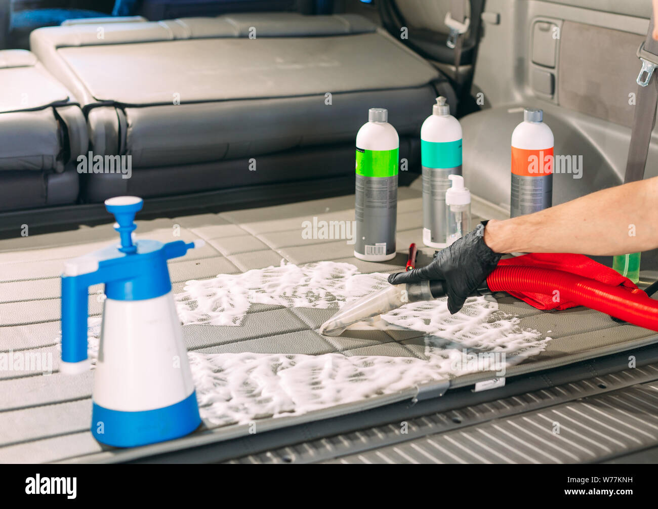 Car chemist. Chemical treatment of the car trunk Stock Photo - Alamy