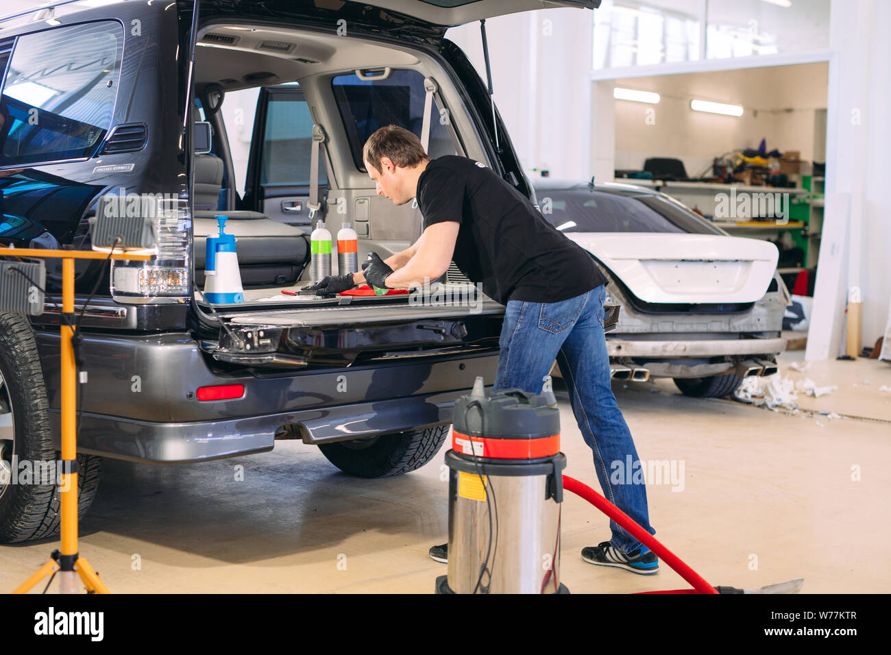 Car chemist. Chemical treatment of the car trunk Stock Photo - Alamy