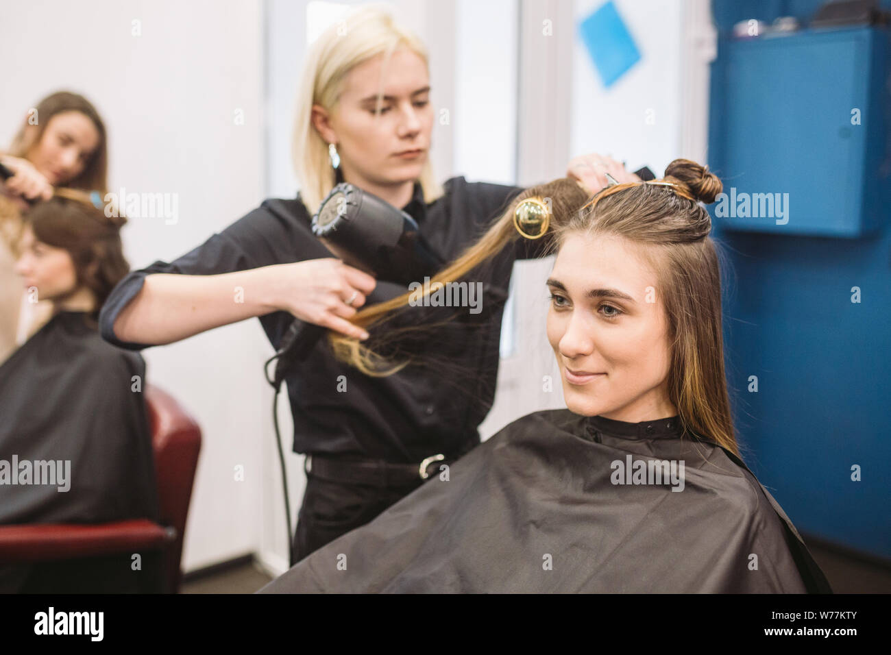 Making hairstyle using hair dryer hi-res stock photography and images ...