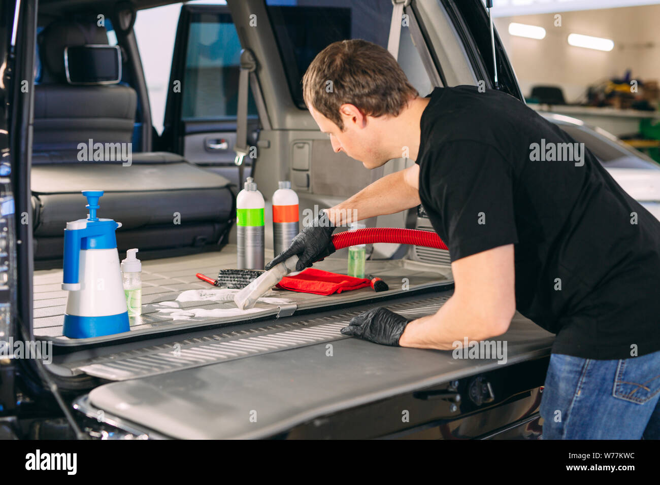 Car chemist. Chemical treatment of the car trunk Stock Photo - Alamy
