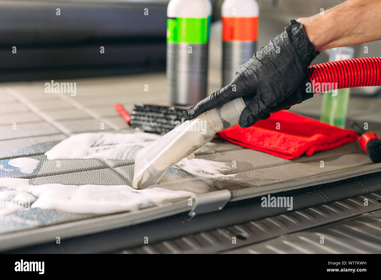 Car chemist. Chemical treatment of the car trunk Stock Photo - Alamy