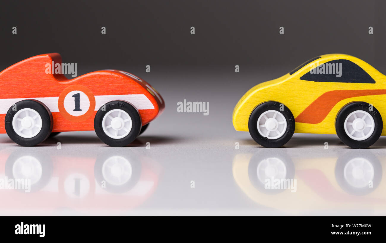Red and yellow toy car close up on a white background Stock Photo - Alamy