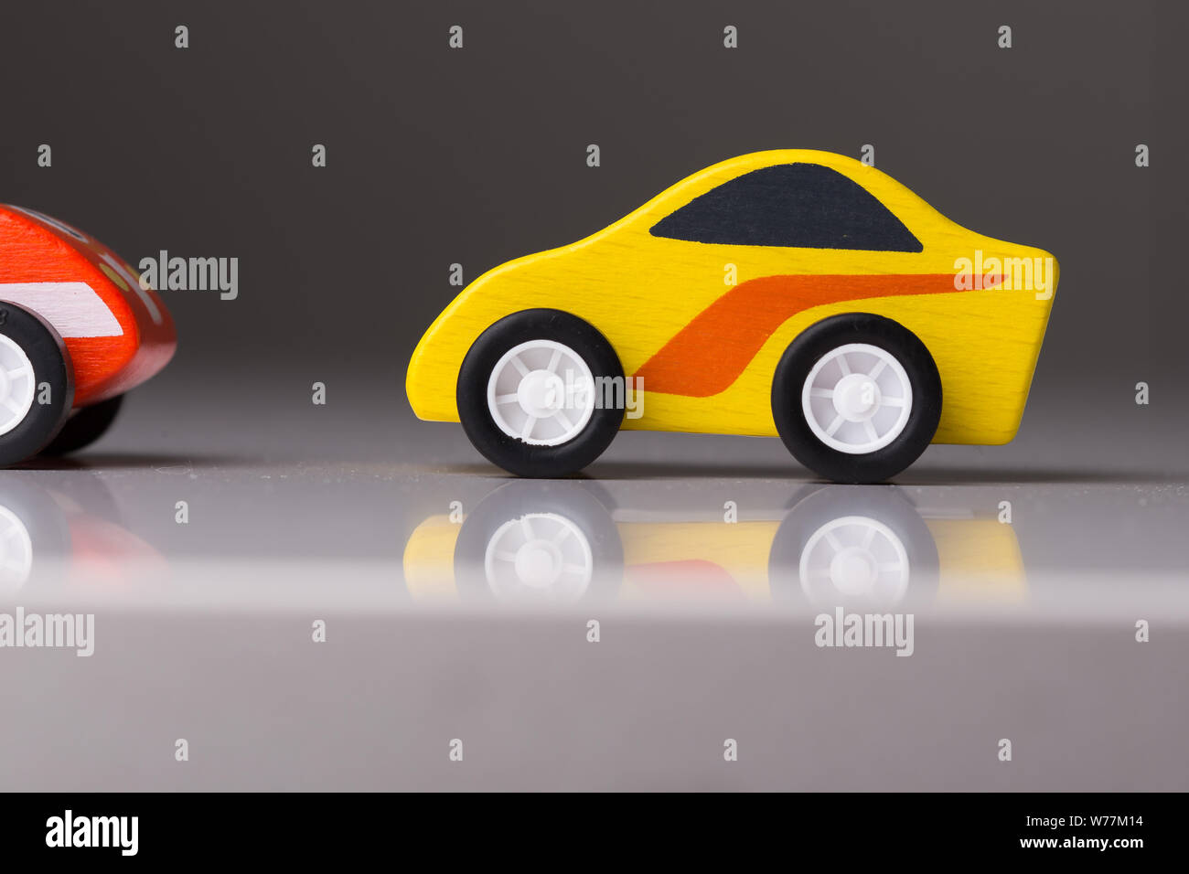 Red and yellow toy car close up on a white background Stock Photo - Alamy