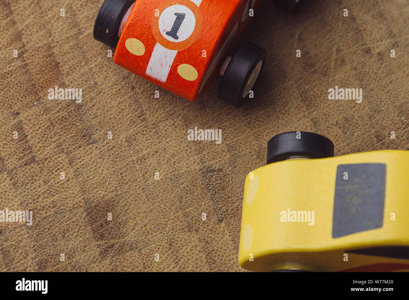 Vintage red and yellow toy car on a wooden surface Stock Photo - Alamy