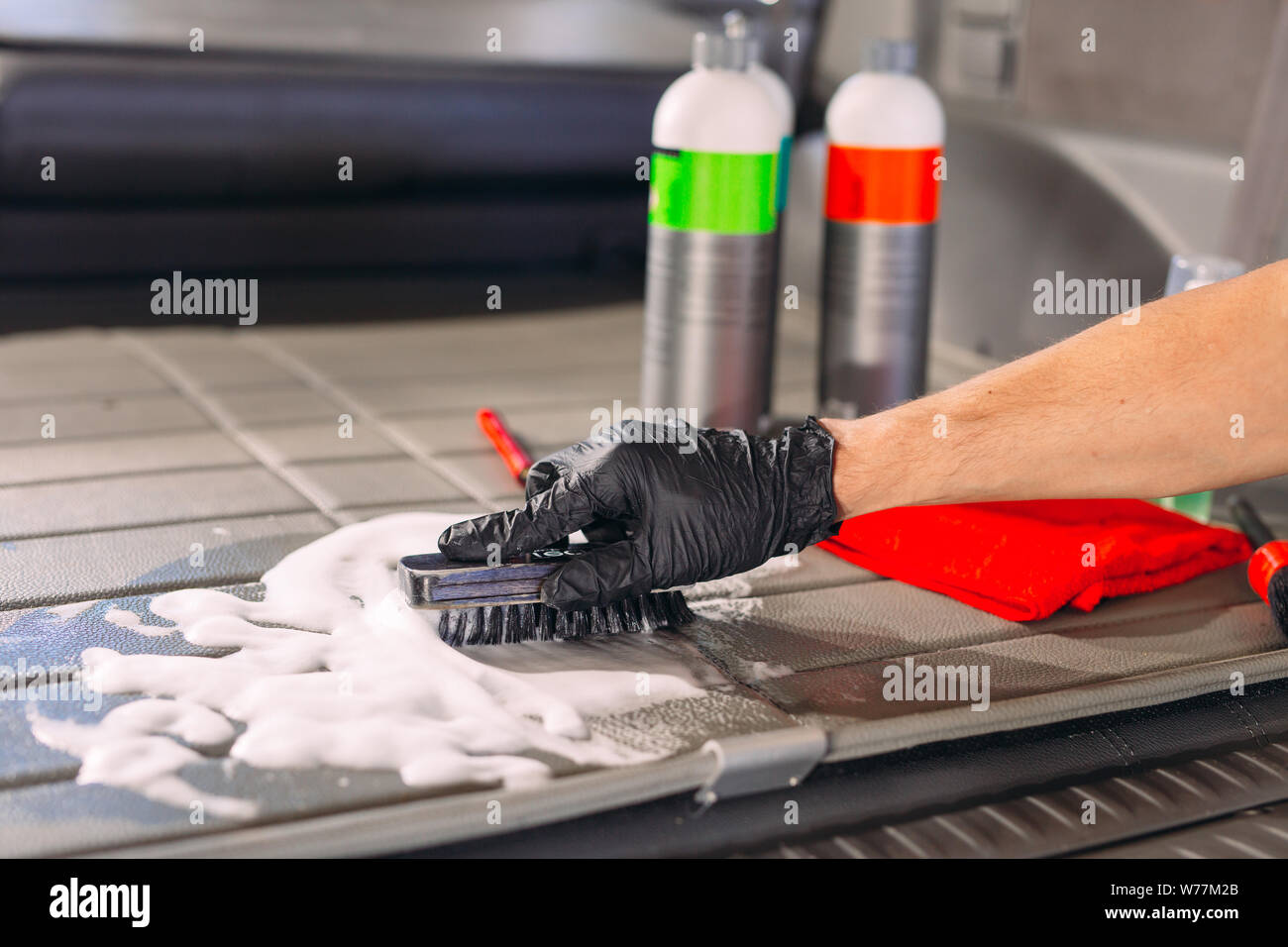 Car chemist. Chemical treatment of the car trunk Stock Photo - Alamy