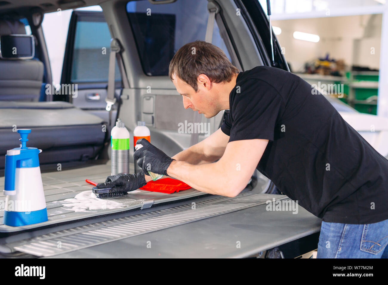Car chemist. Chemical treatment of the car trunk Stock Photo - Alamy