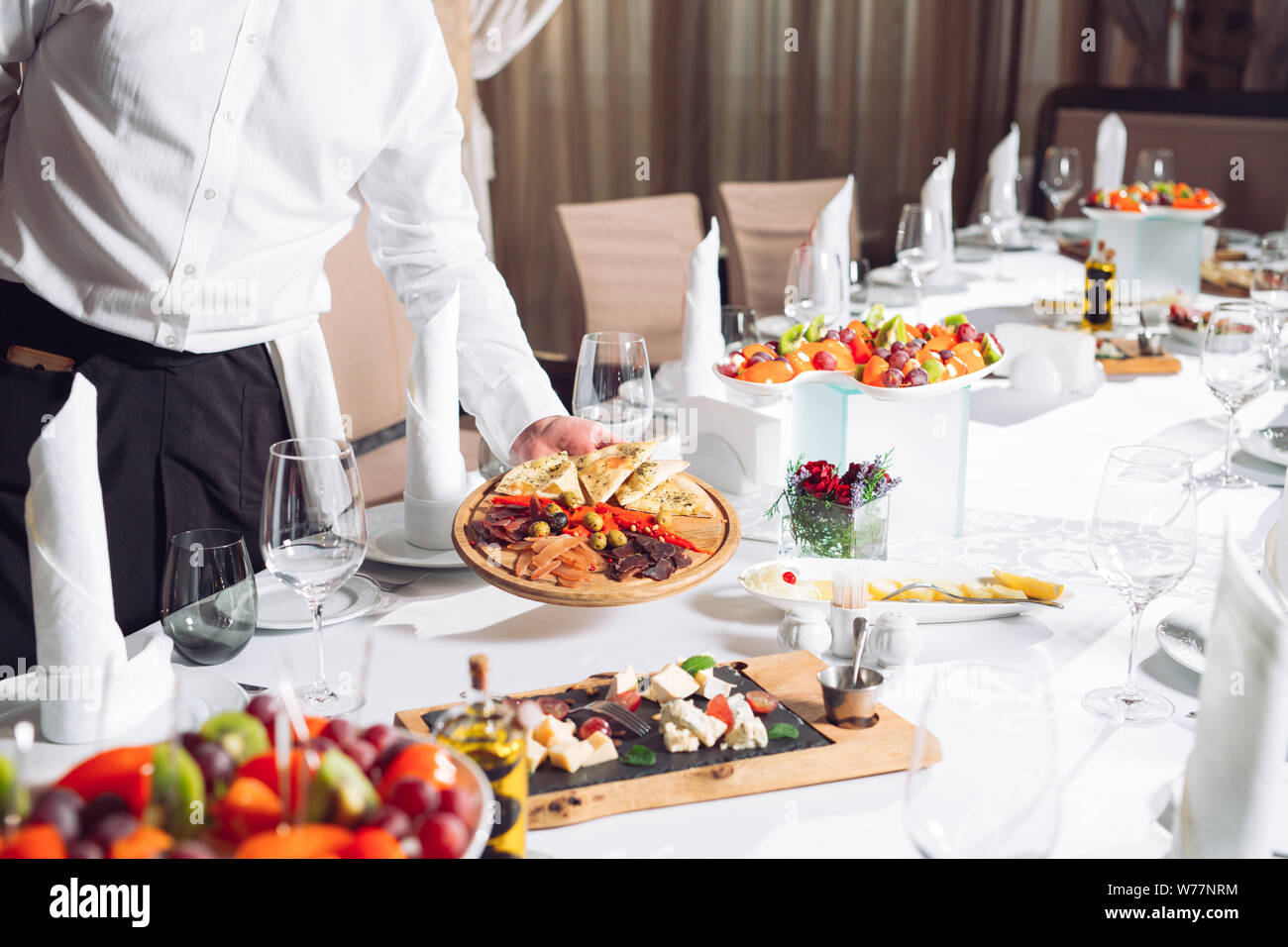 Fancy dinner waiter hi-res stock photography and images - Alamy
