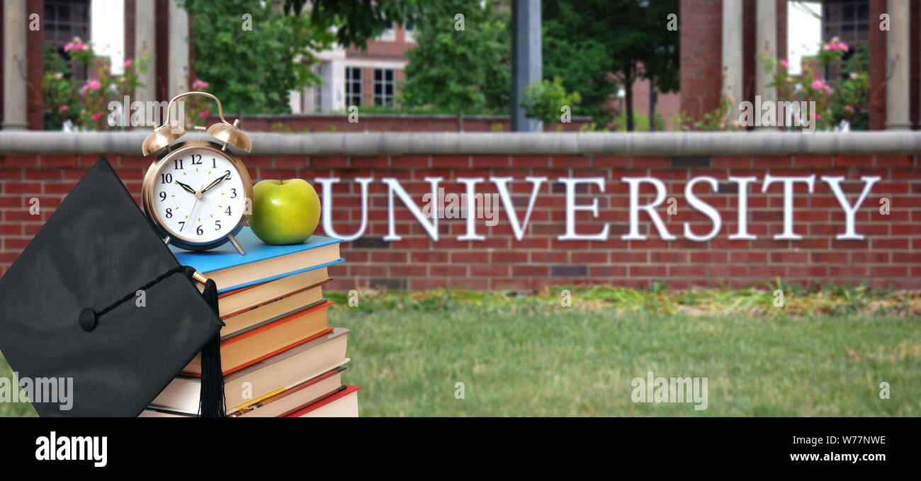 a pile of books in front of university for education concept Stock ...