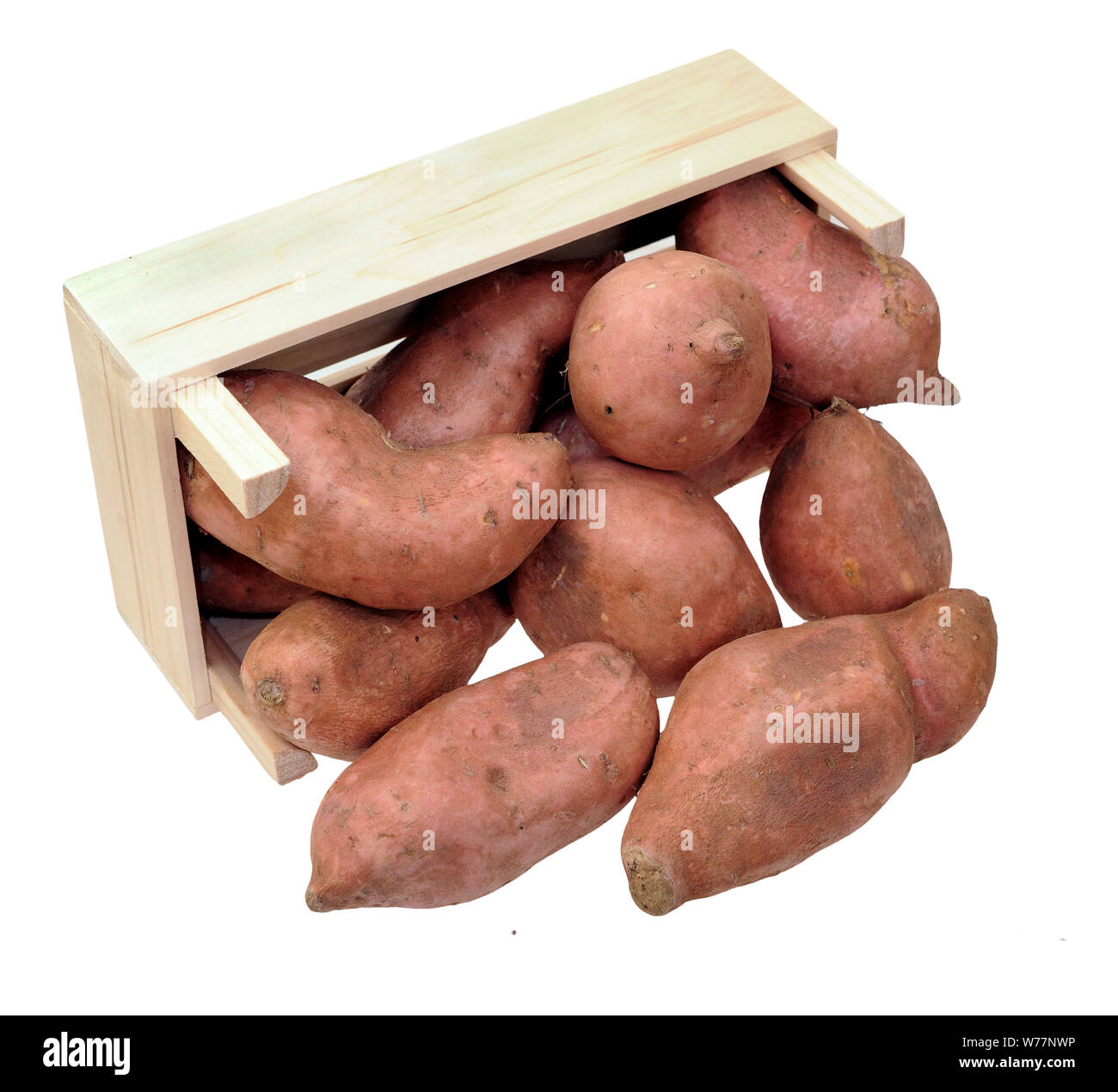 a pile of sweet potatoes fall out of crate Stock Photo - Alamy