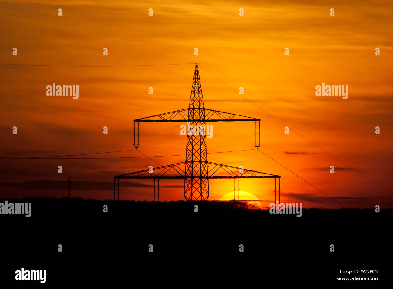 Silhouette of a power pole in the sunset Stock Photo - Alamy
