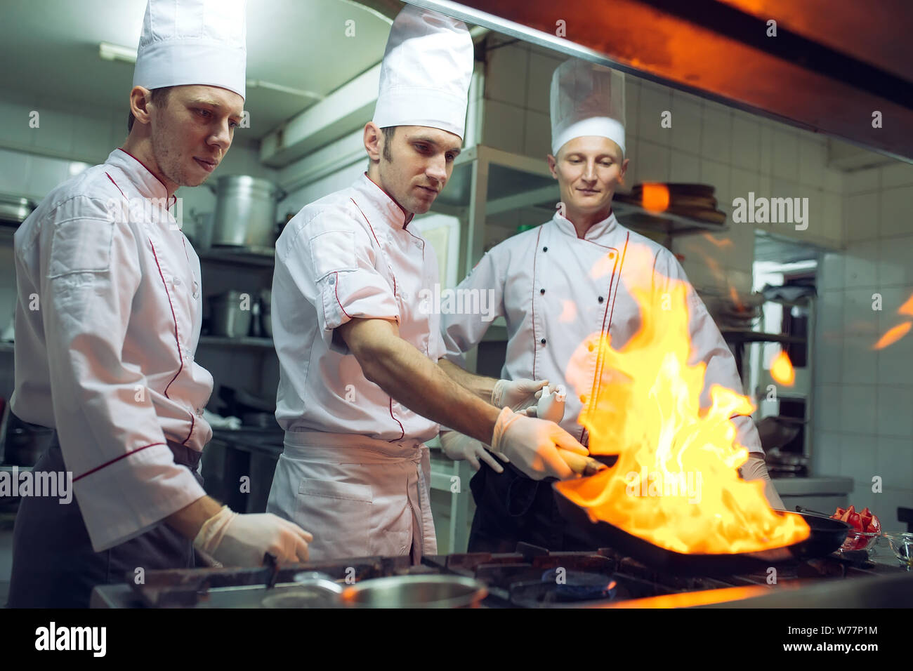 Fire in the kitchen. Fire gas burn is cooking on iron pan,stir fire ...