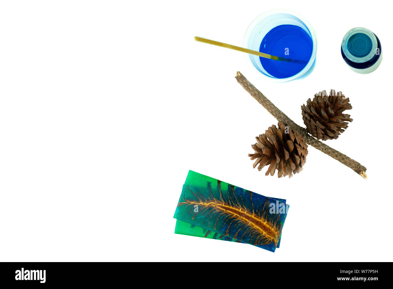 Casting pine cone hybrid and mixing color epoxy resin in plastic cup at ...