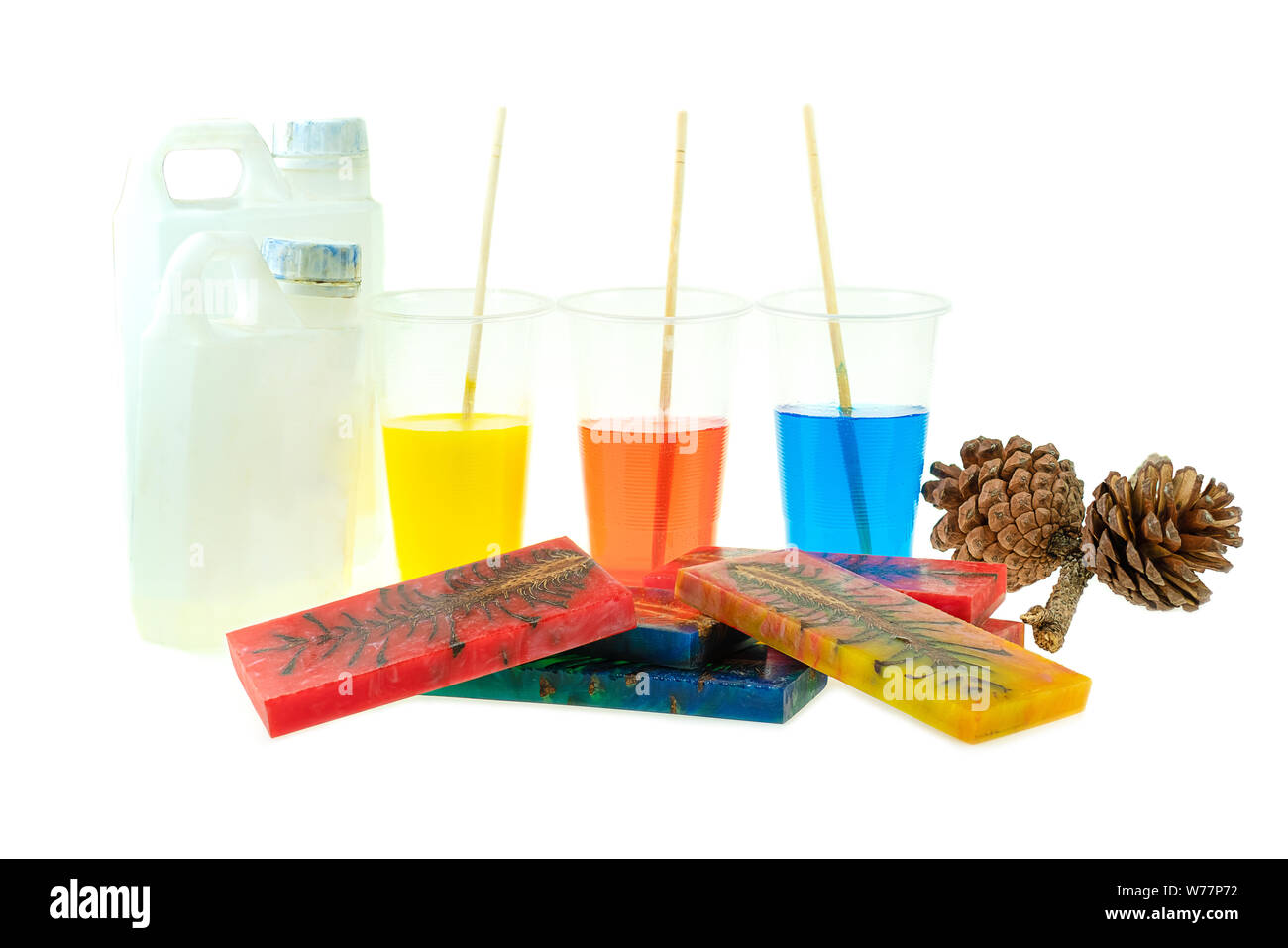 Casting pine cone hybrid and mixing color epoxy resin in plastic cup at ...