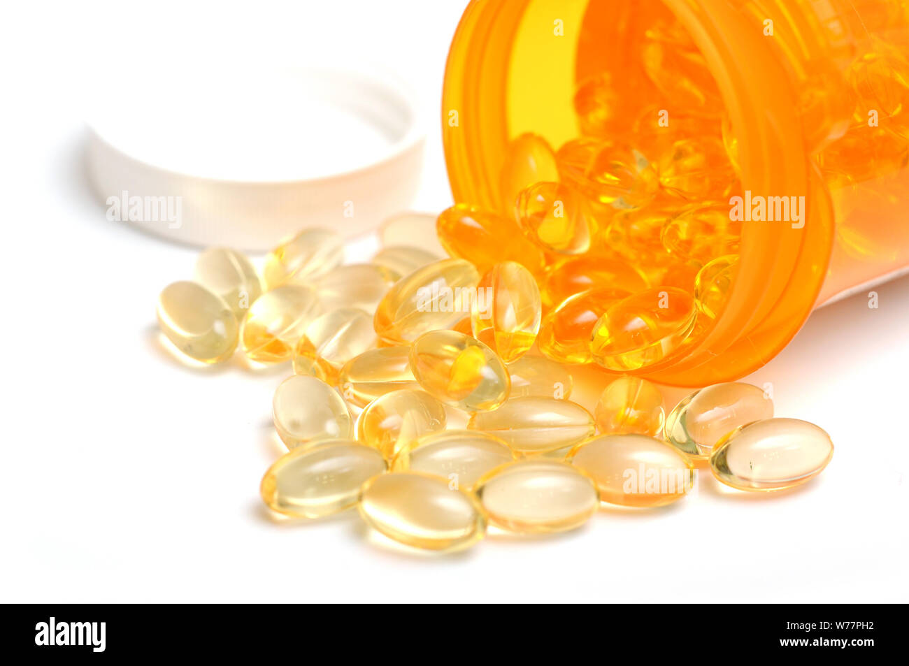 yellow transparent medicine in container on white background Stock ...