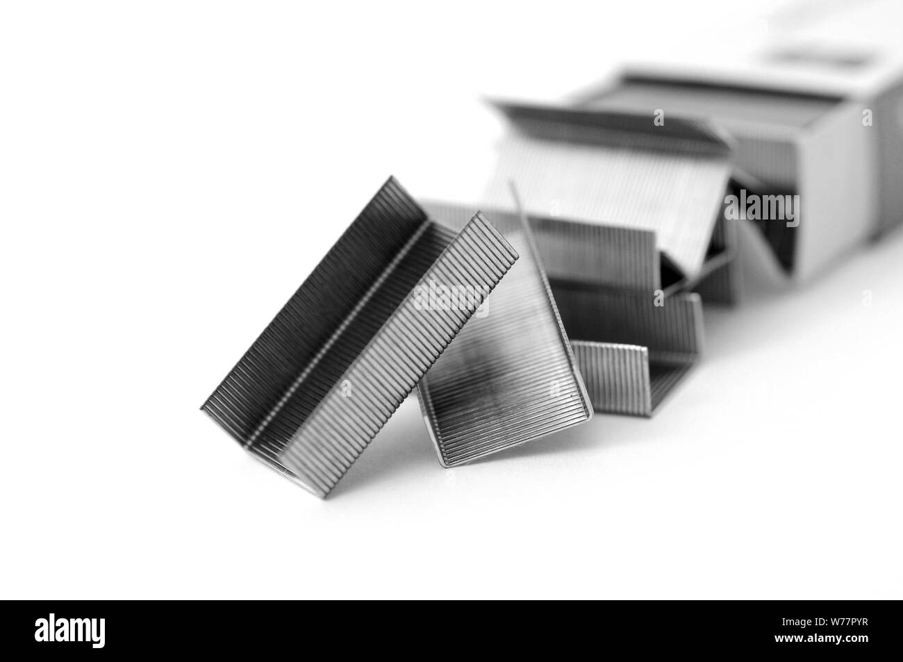 a lot of staple on white background Stock Photo - Alamy