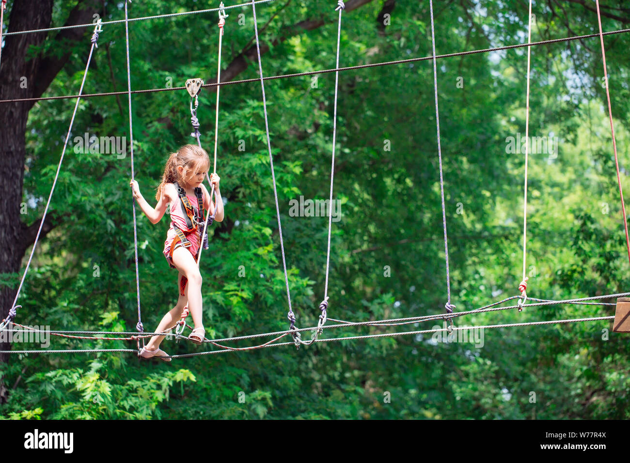 Girl on high ropes hi-res stock photography and images - Alamy
