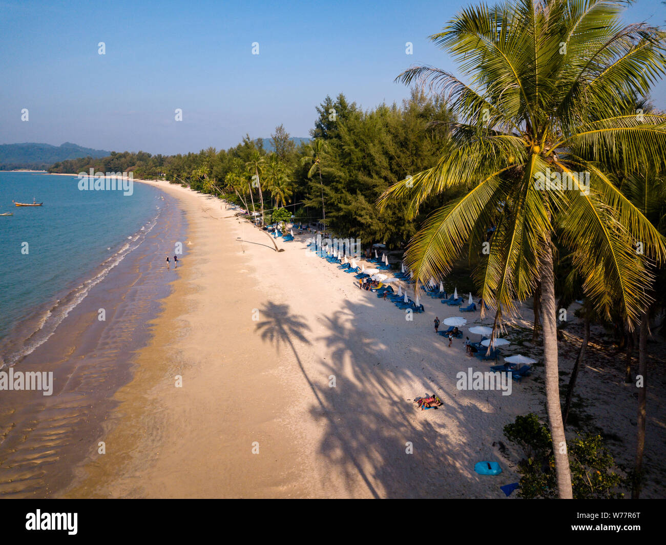 Beautiful late evening shadows on a deserted tropical beach viewed from the air Stock Photo - Alamy