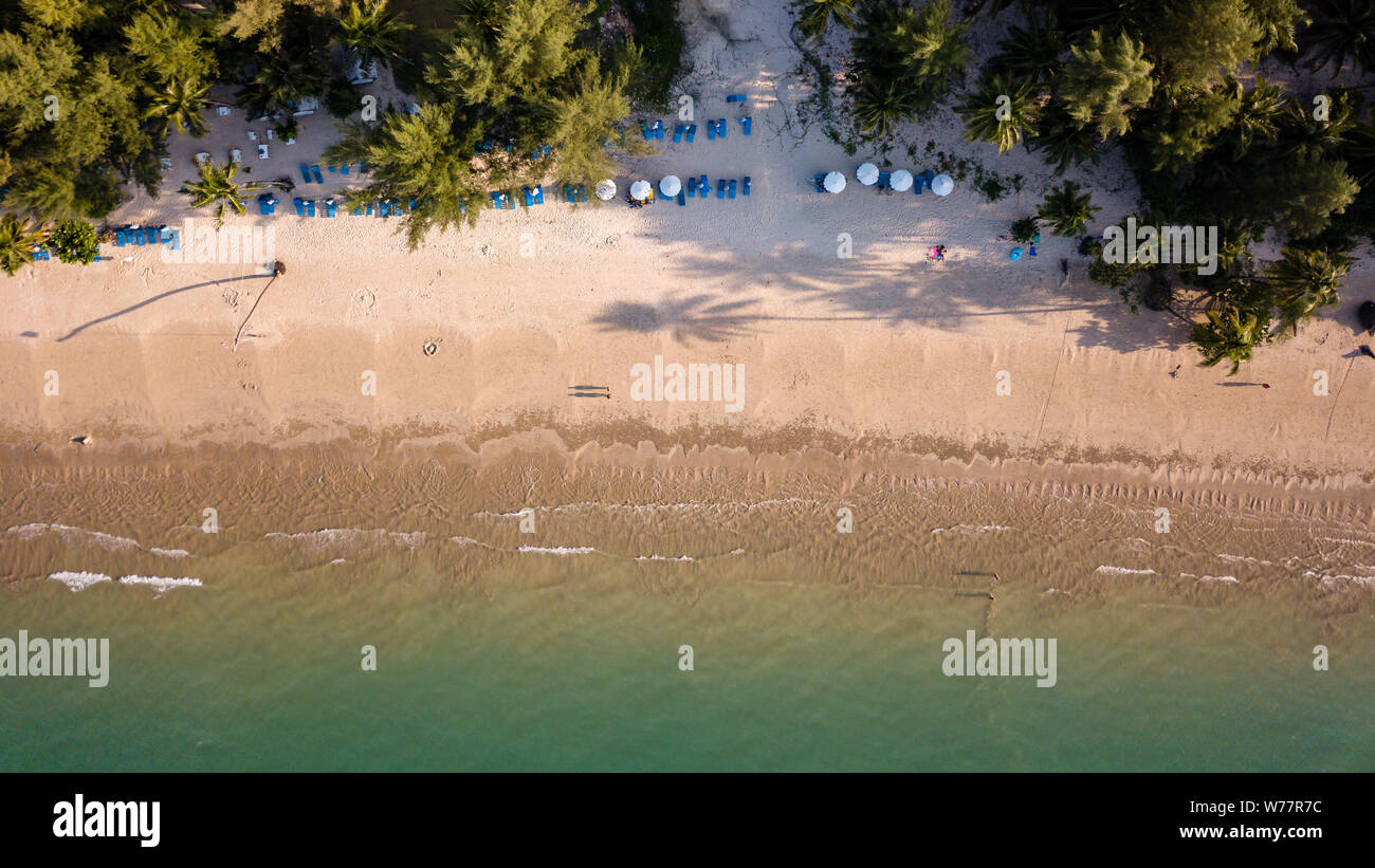 Beautiful late evening shadows on a deserted tropical beach viewed from the air Stock Photo - Alamy
