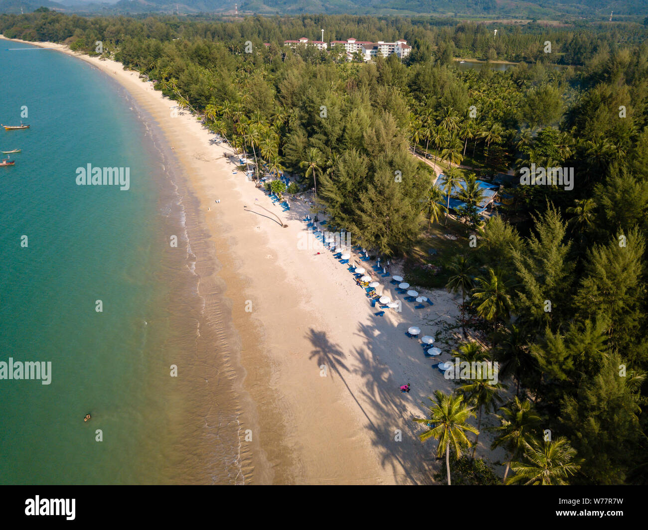 Beautiful late evening shadows on a deserted tropical beach viewed from the air Stock Photo - Alamy
