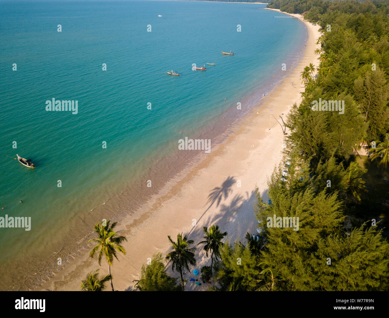 Beautiful late evening shadows on a deserted tropical beach viewed from the air Stock Photo - Alamy