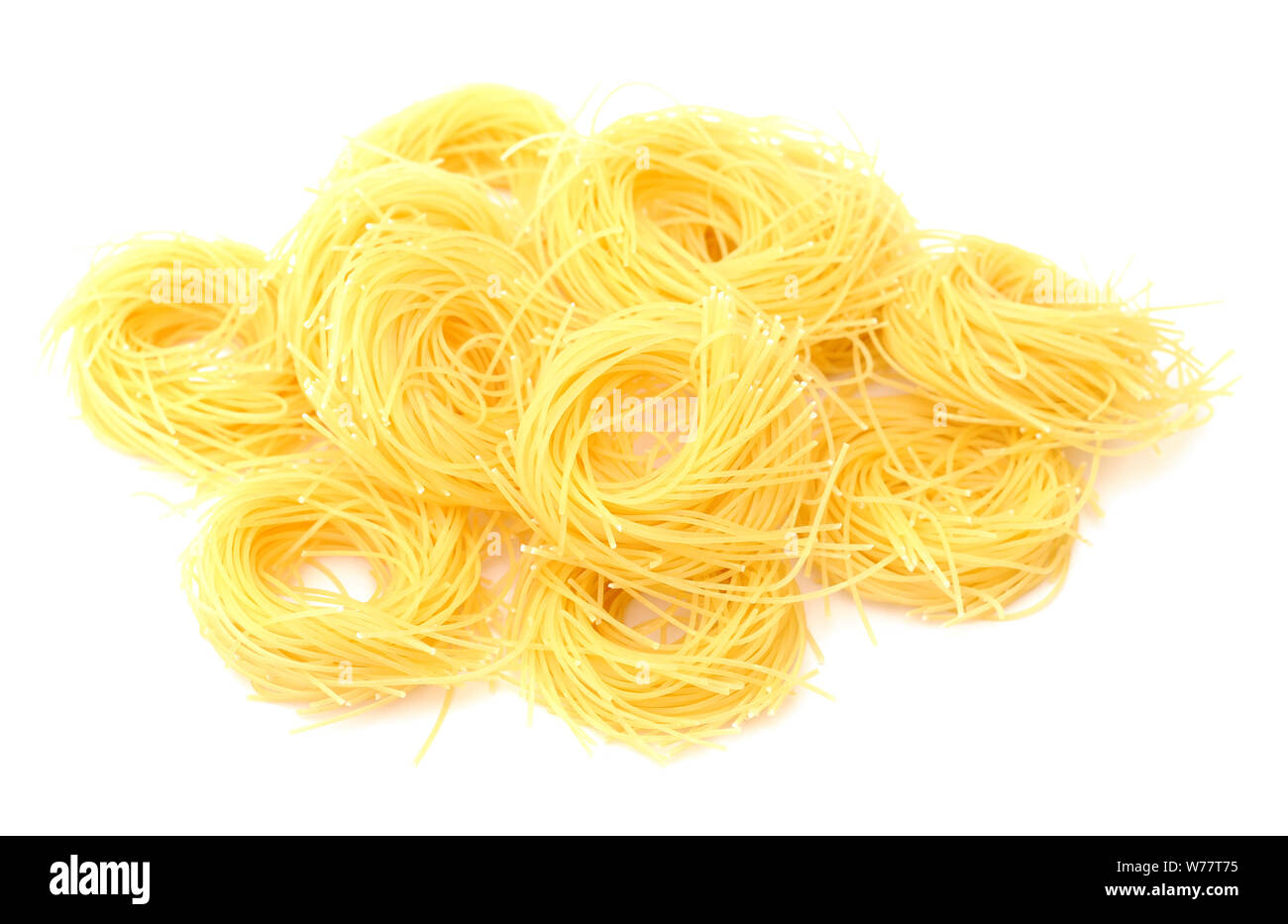 nested pasta on white background Stock Photo - Alamy