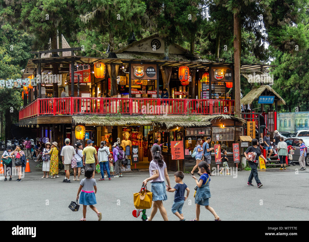 Nantou, Taiwan - August 3, 2019: Tourists walk around shops at Xitou ...