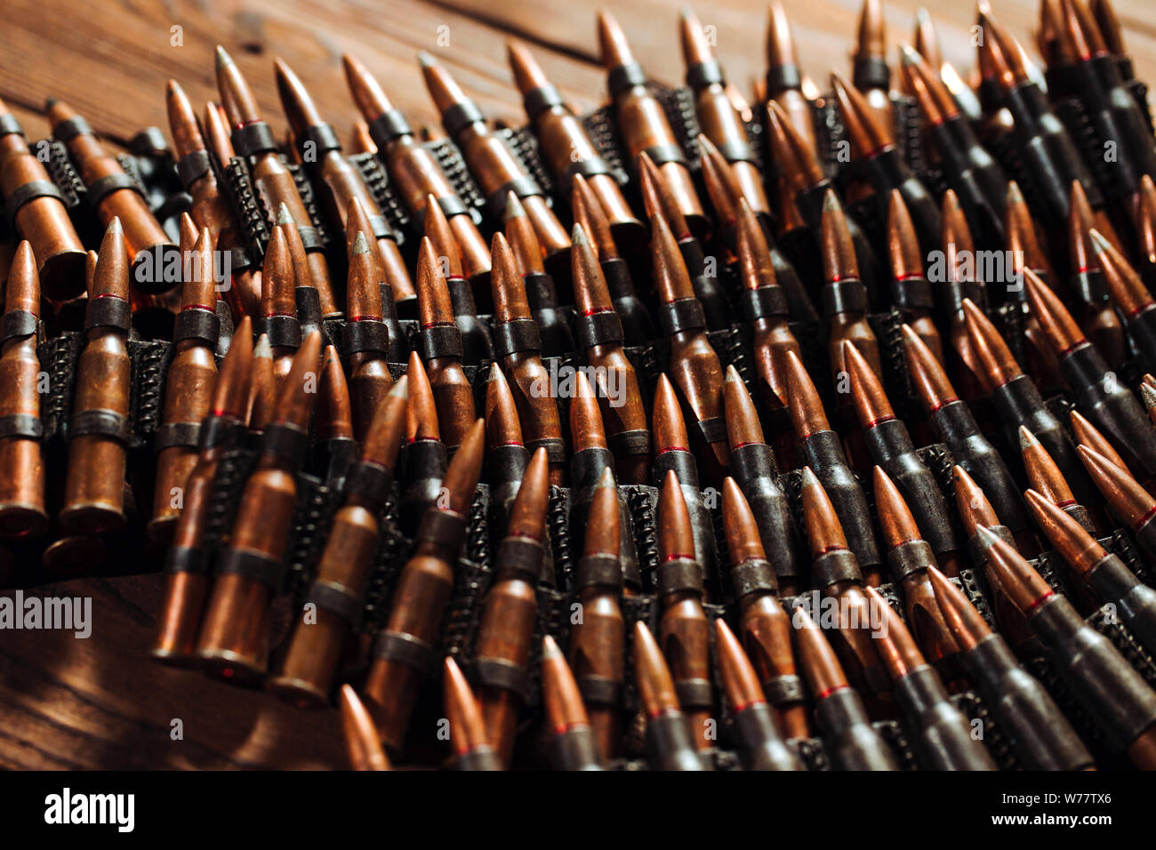 Bullets on a wooden background. Military concept Stock Photo - Alamy