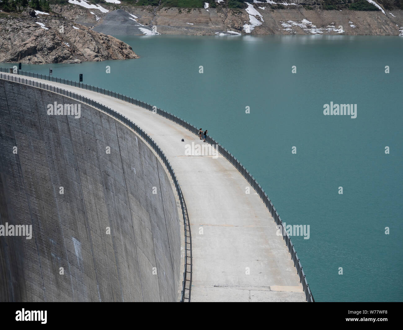 Water reservoir Lac de Emosson, people walking in the dam, Lac d ...
