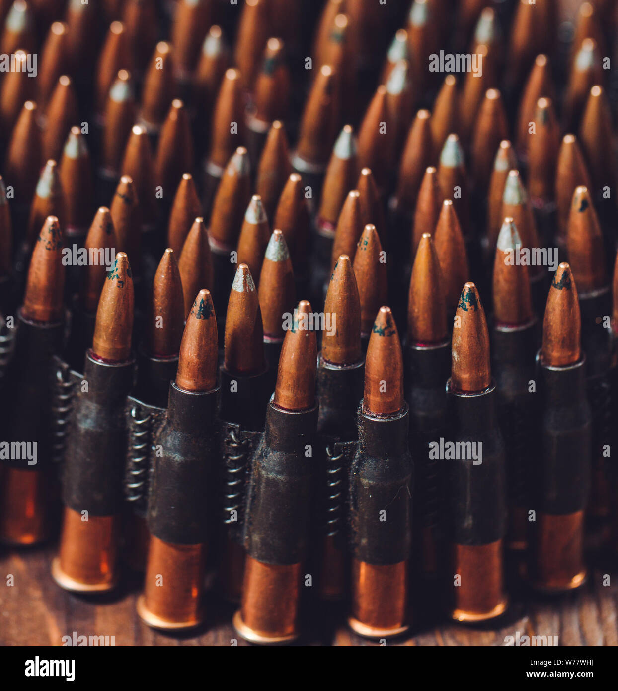 Bullets on a wooden background. Military concept Stock Photo - Alamy