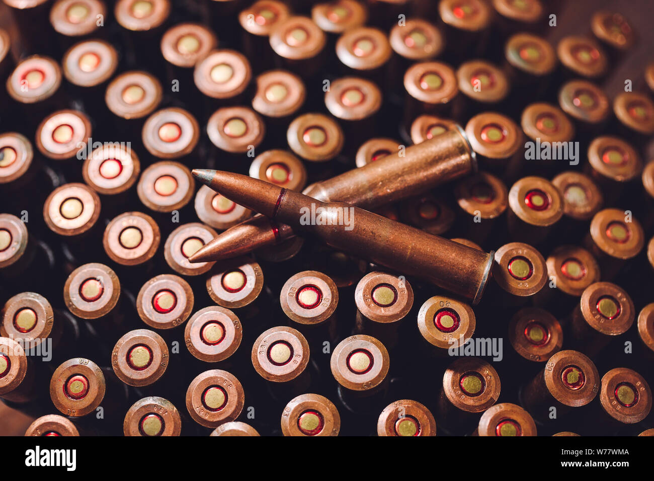 Bullets on a wooden background. Military concept Stock Photo - Alamy
