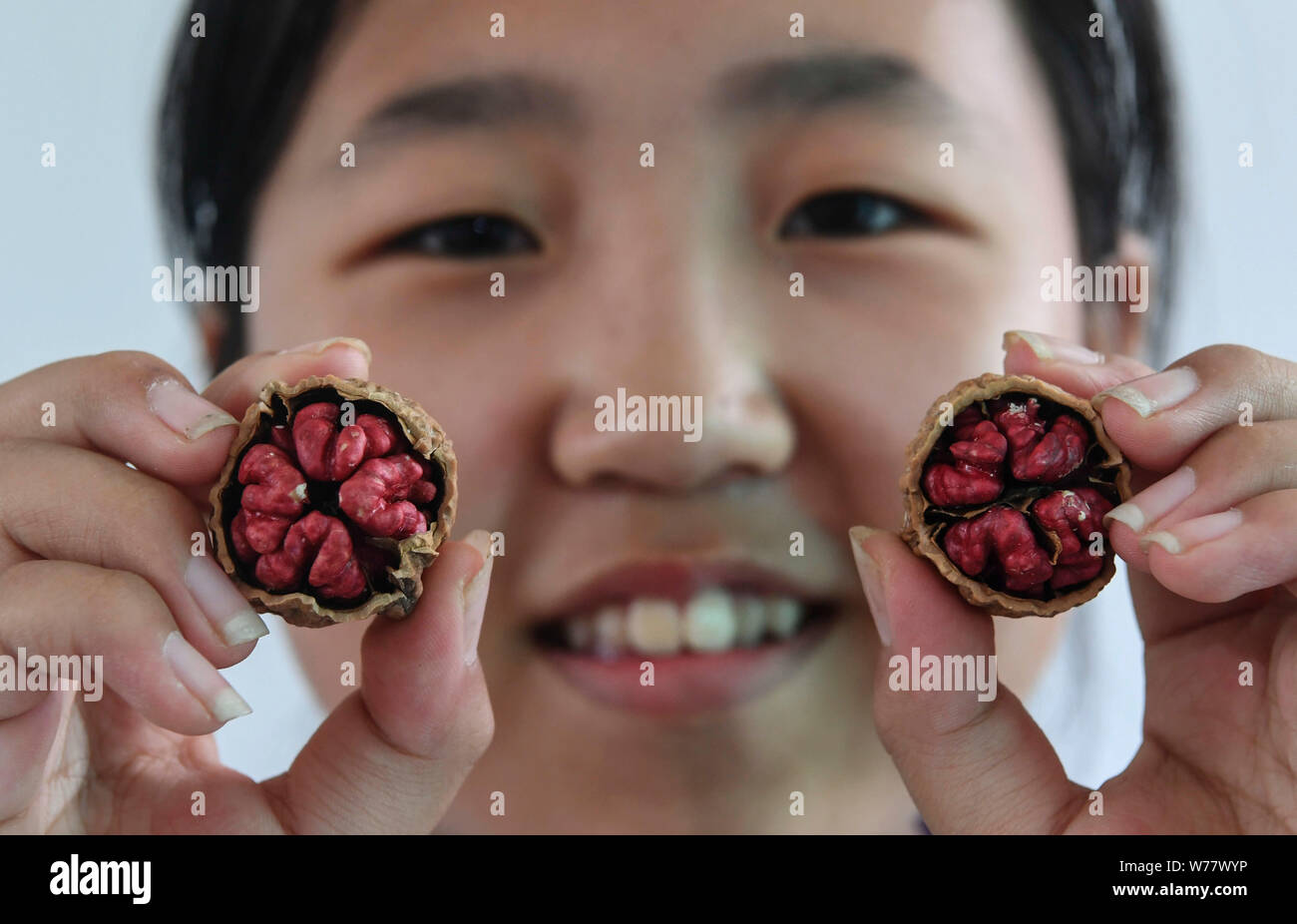 Luonan, China's Shaanxi Province. 5th Aug, 2019. A villager displays ...
