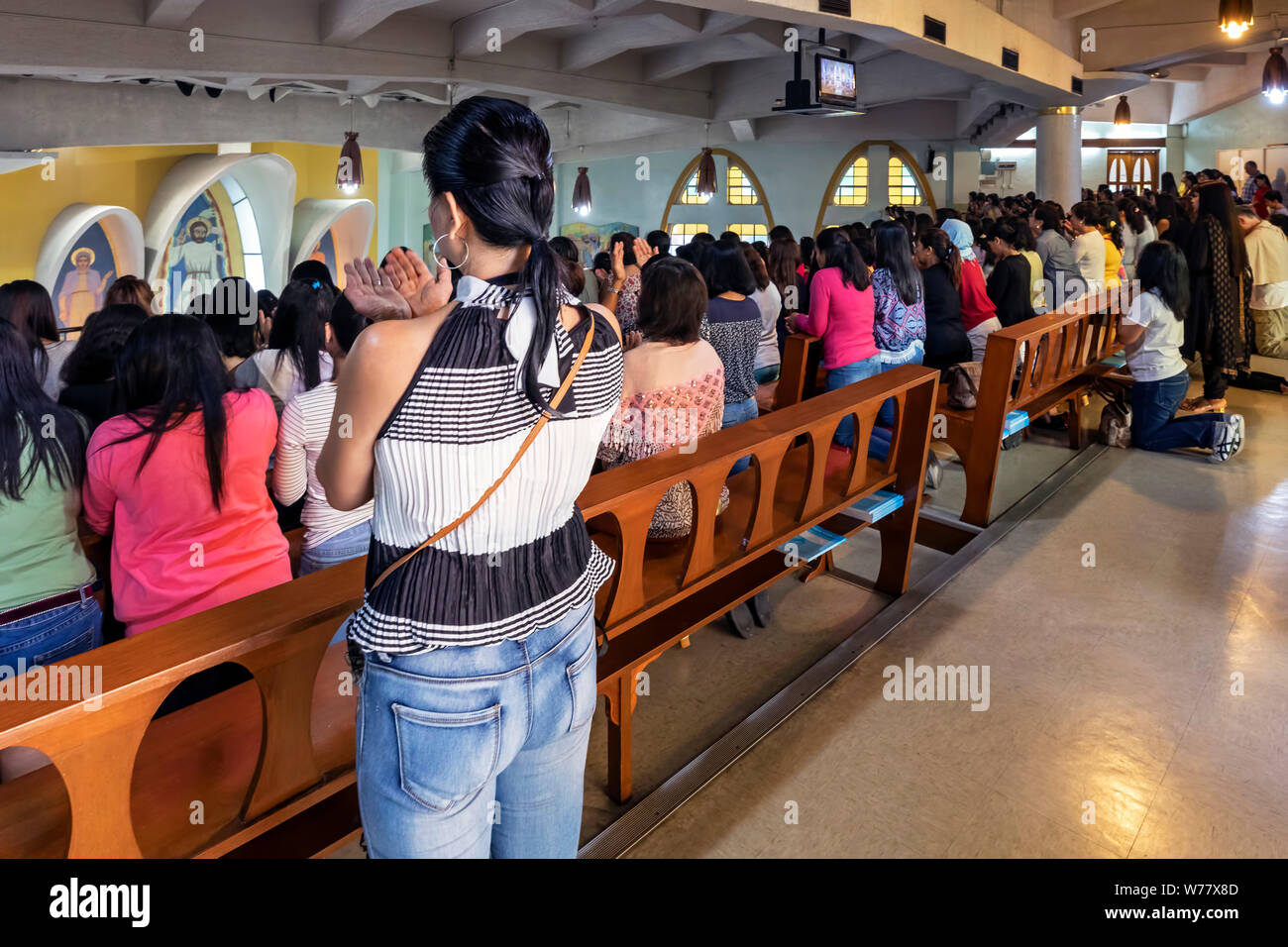 Filipino Praying In Church